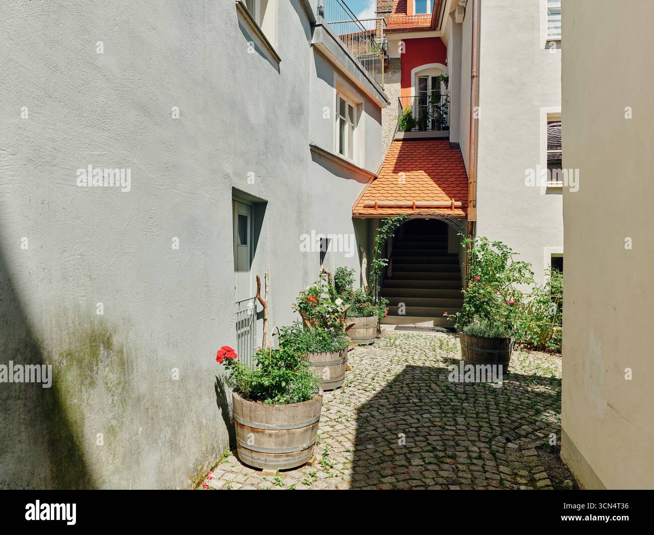 Narrow alley flower pots hi-res stock photography and images - Alamy