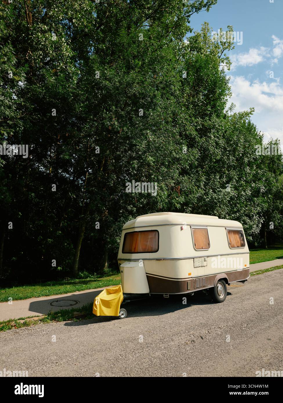 Vintage caravan parked near green trees Stock Photo - Alamy