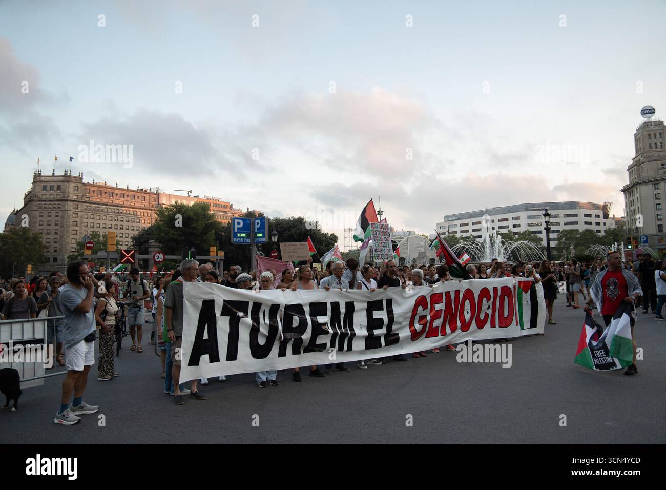 Protesters hold a banner with the slogan "Stop the Genocide" during the ...