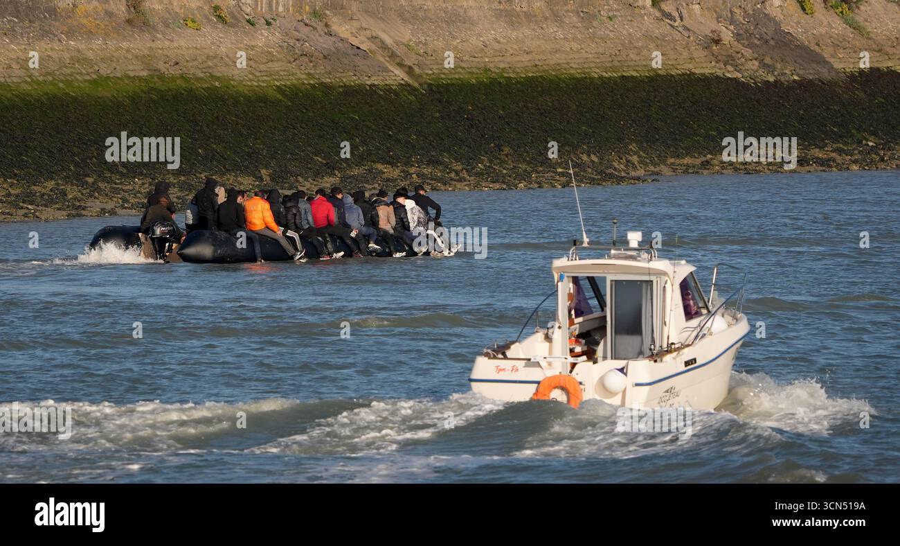 A small boat carrying people thought to be migrants leaves Gravelines ...