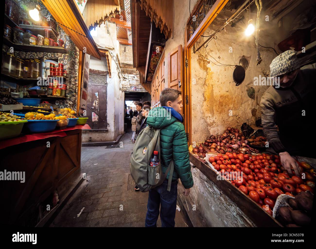 Fez, Morocco, Jan 4 2023, In the bustling Fez medina, a fruit vendor ...