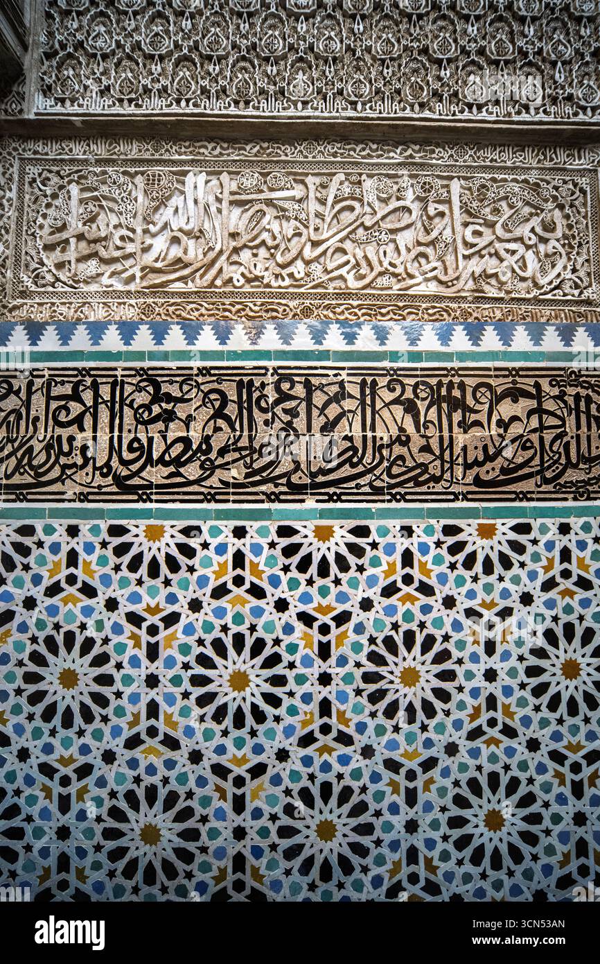 Detailed zellij tiles and carved stucco with kufic calligraphy adorn ...