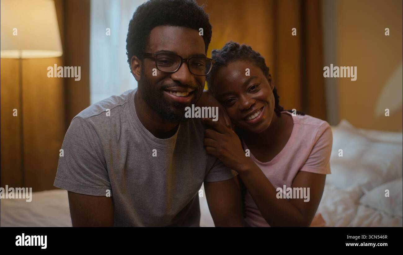 Happy loving embracing African American family married joyful couple ...