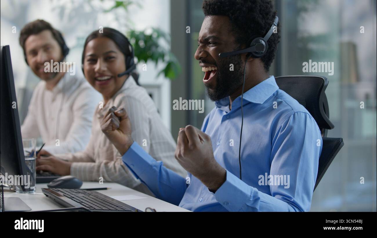 Happy excited multiethnic coworkers African and Caucasian men business ...