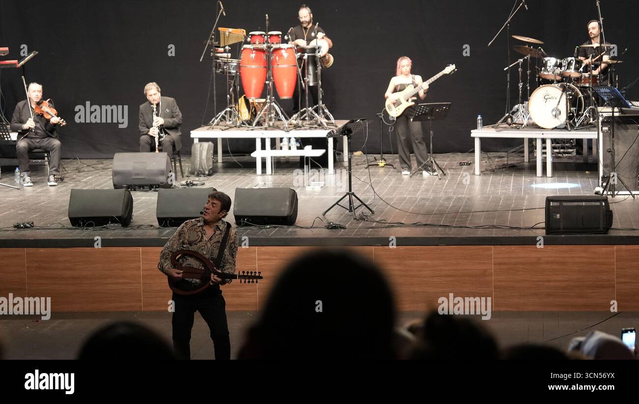 Turkish singer Coşkun Sabah performs on stage at Gaziantep University ...