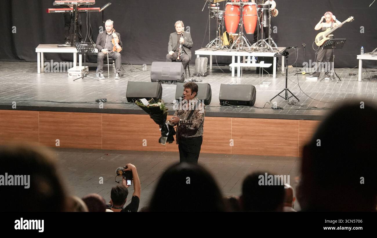 Turkish singer Coşkun Sabah performs on stage at Gaziantep University ...