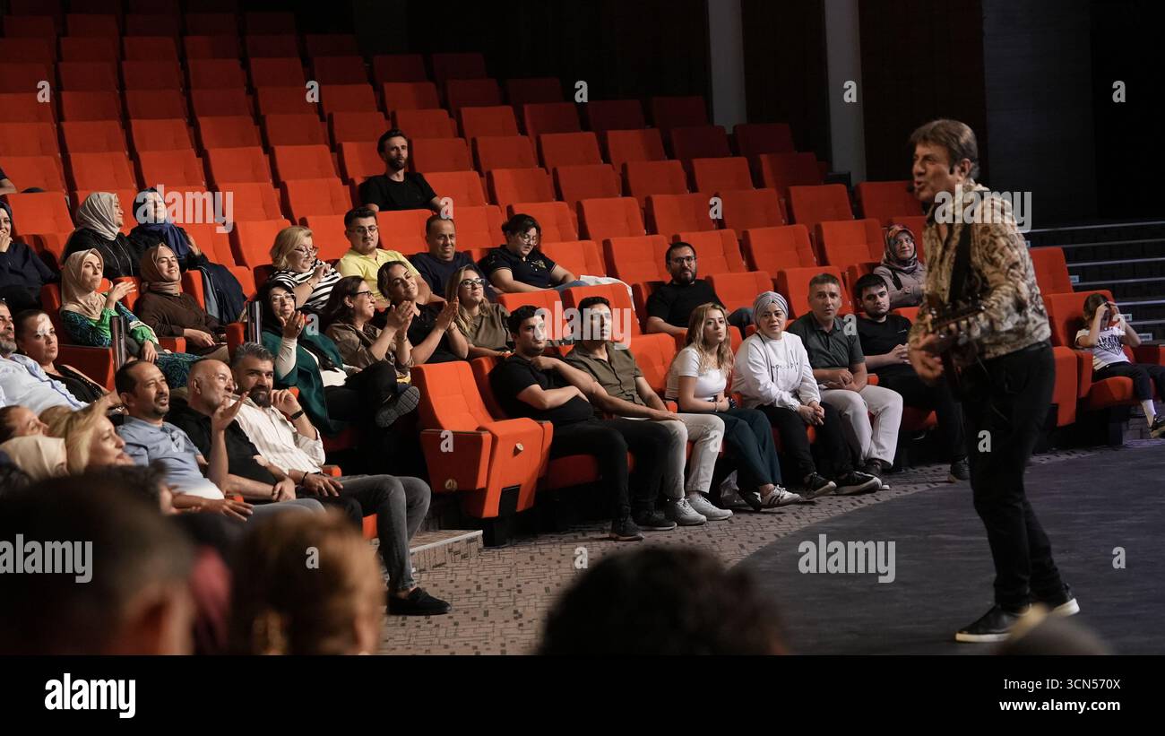 Turkish singer Coşkun Sabah performs on stage at Gaziantep University ...