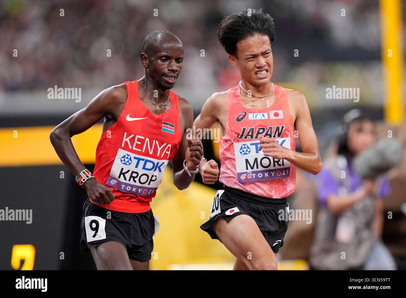 Japan's Nagiya Mori races ahead of Kenya's Jacob Krop to compete in men's 5,000 meters heat at ...