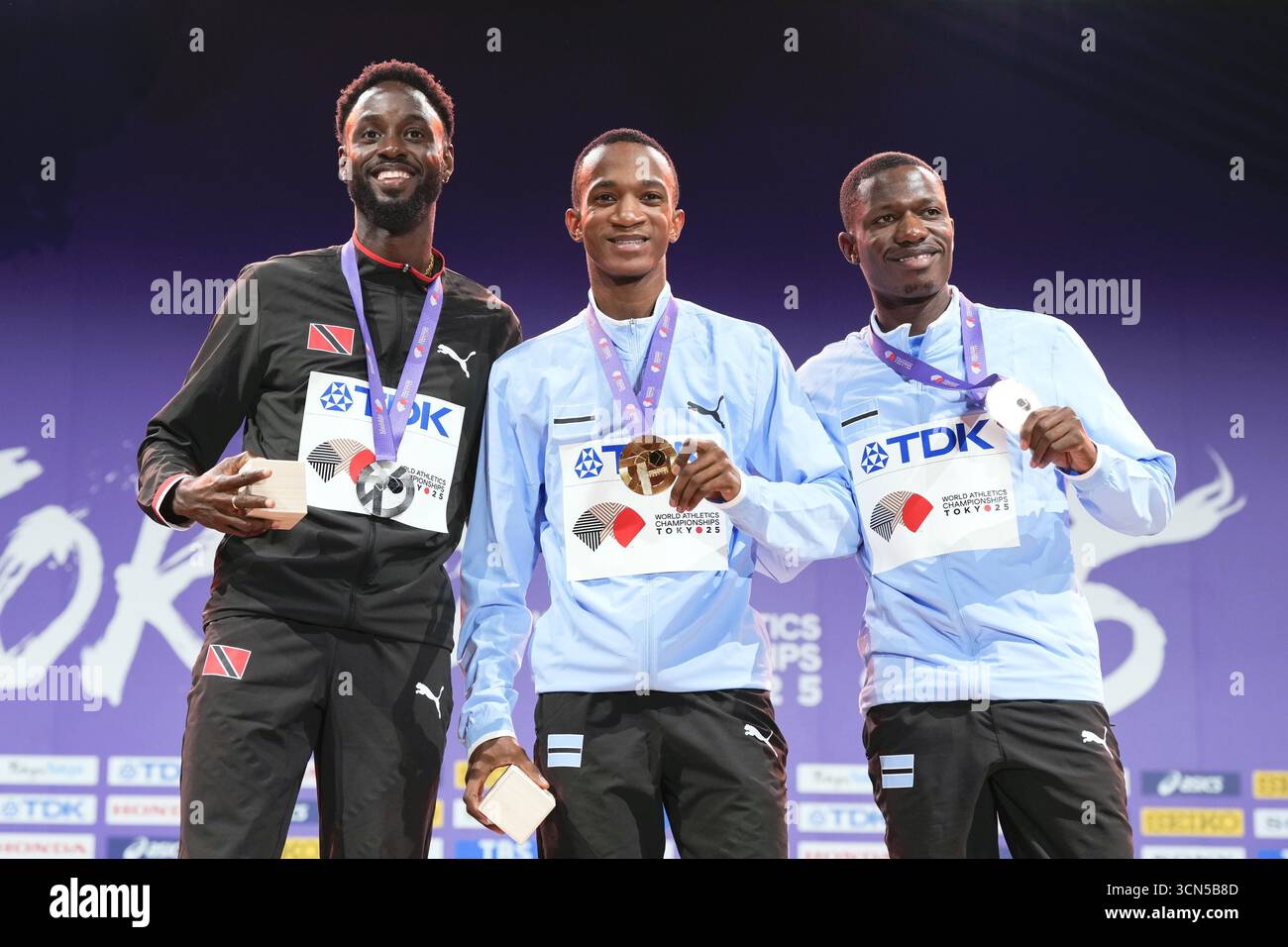 Gold medalist Busang Collen Kebinatshipi (C) of Botswana poses during ...