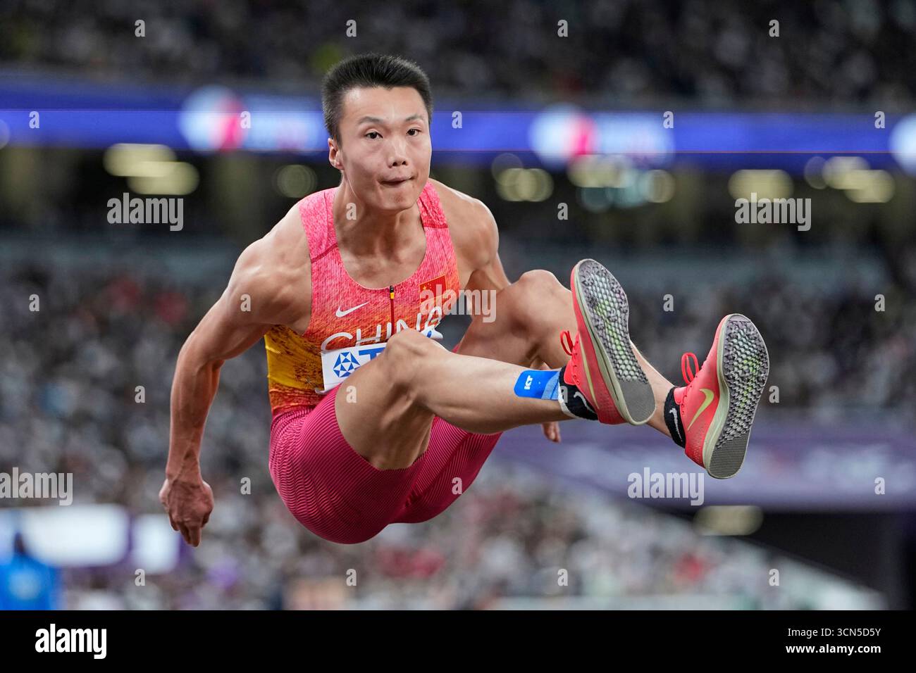 China's Su Wen competes in the men's triple jump final at the World ...