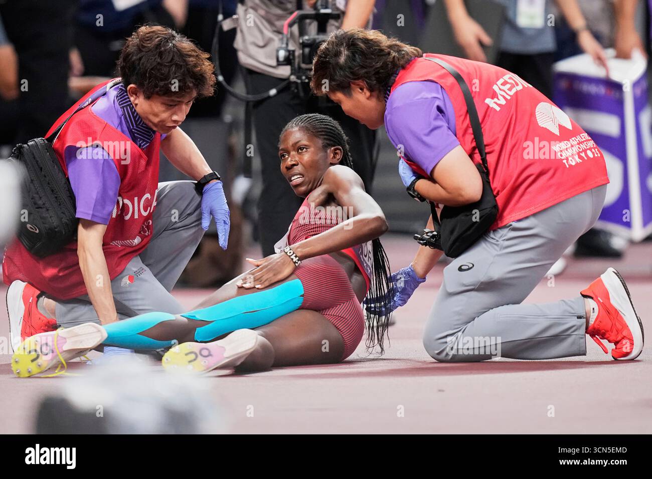 Medics attend to Kenya's Sarah Moraa during women's 800 meters ...