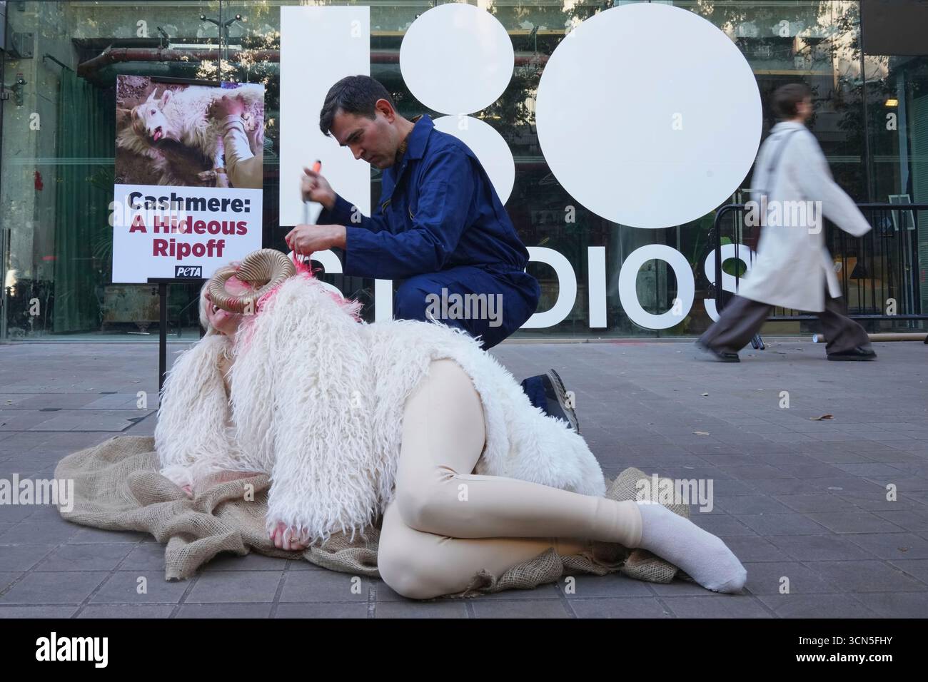 PETA activists protest outside of the London Fashion Week, with a ...