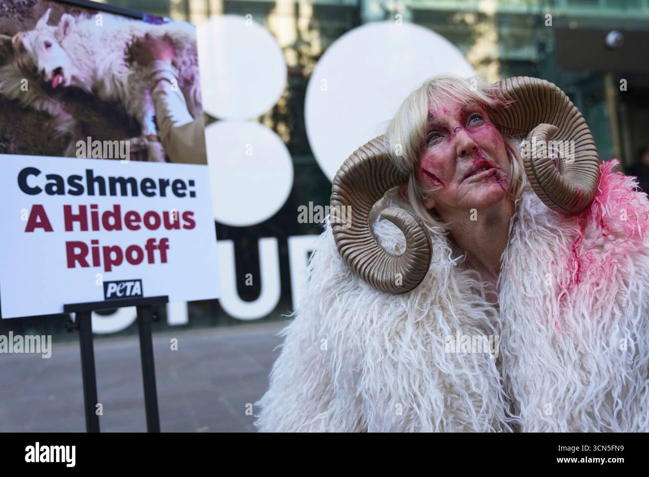 PETA activists protest outside of the London Fashion Week, with a ...