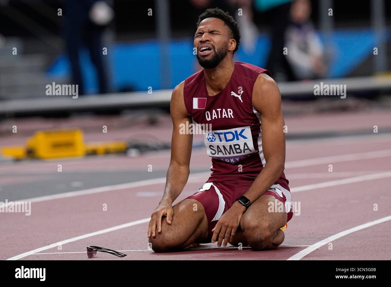 Qatar's Abderrahman Samba reacts after competing in the men's 400 ...