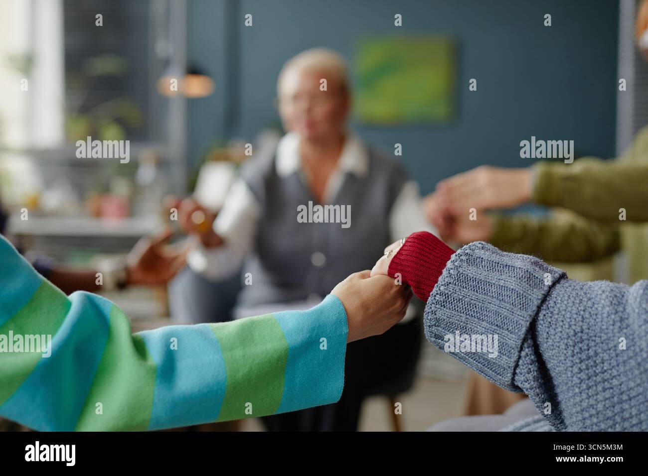 Diverse Group of People Holding Hands in Support Circle Stock Photo - Alamy