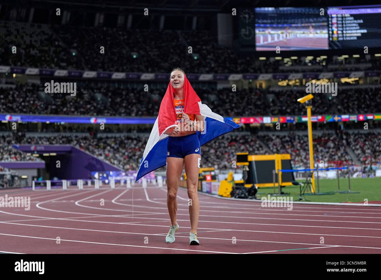 Netherlands' Femke Bol celebrates winning the gold medal in the women's ...
