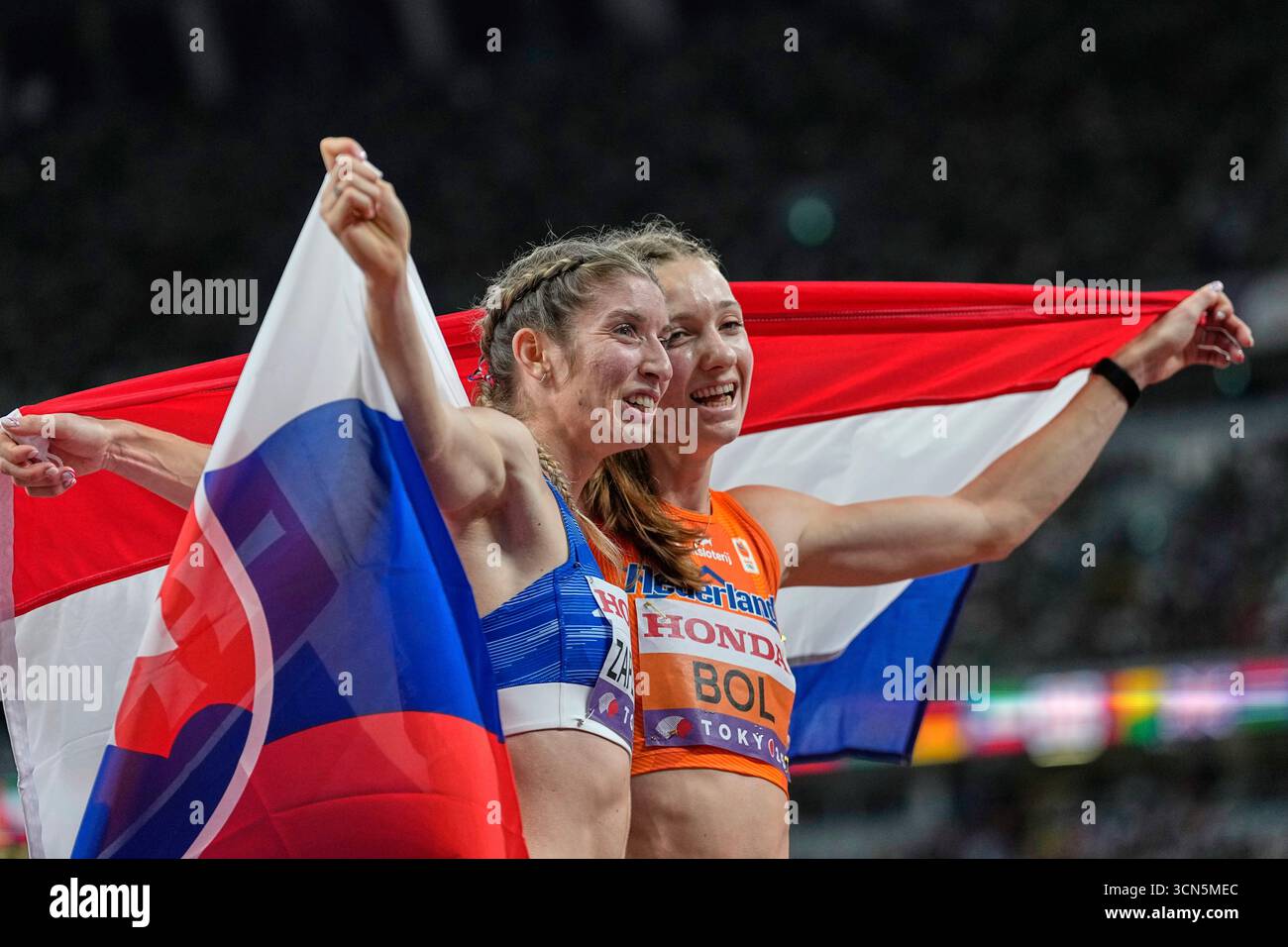 Netherlands' Femke Bol celebrates winning the gold medal with bronze ...