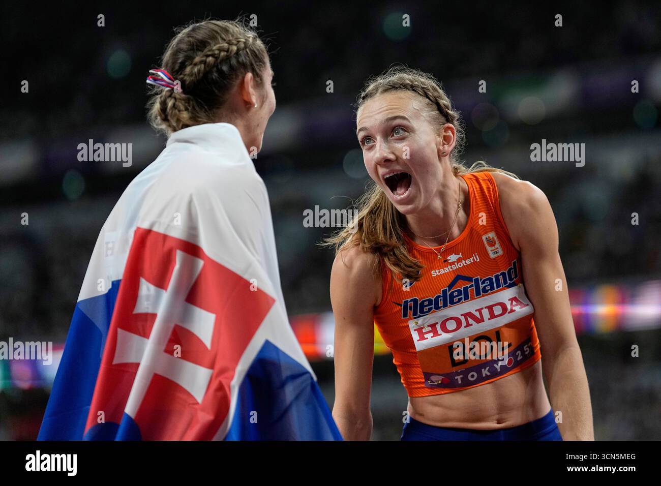 Netherlands' Femke Bol celebrates winning the gold medal with bronze ...