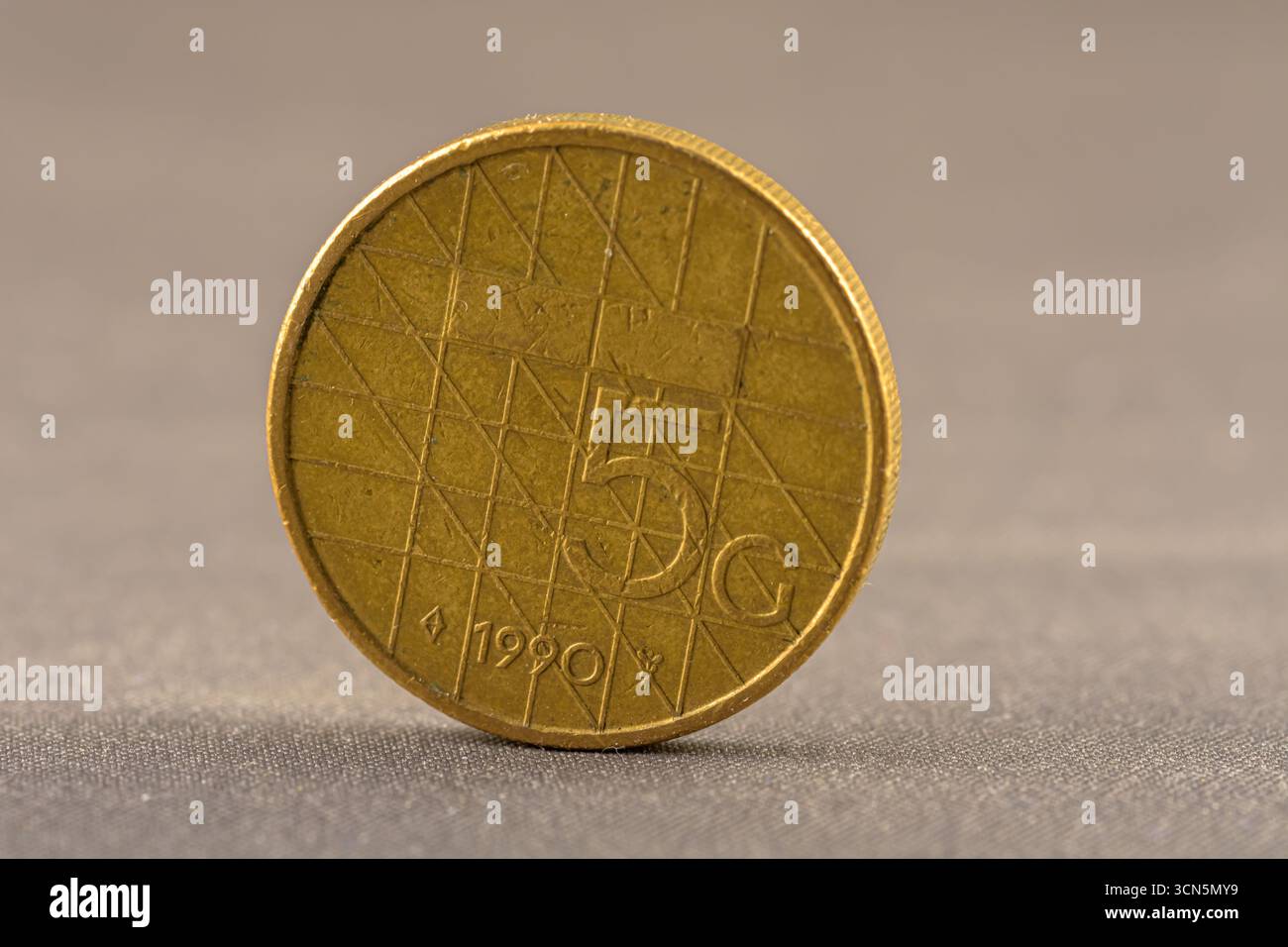 Front side of a former 5 guilder coin from the Netherlands Stock Photo ...