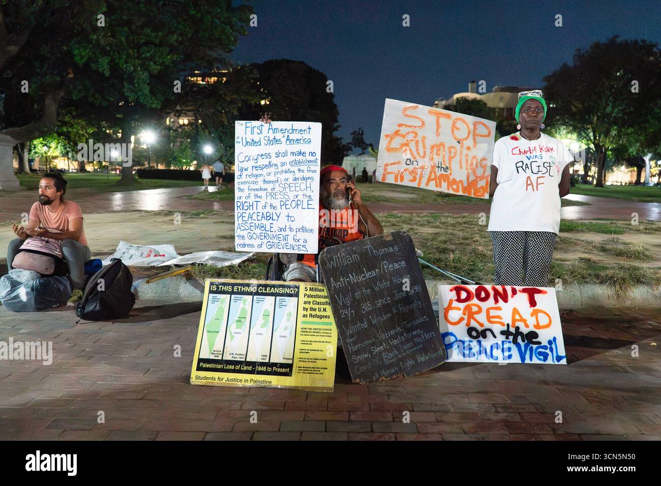Philipos Melaku-Bello, center and Nadine Seiler of Waldorf, Md., right ...