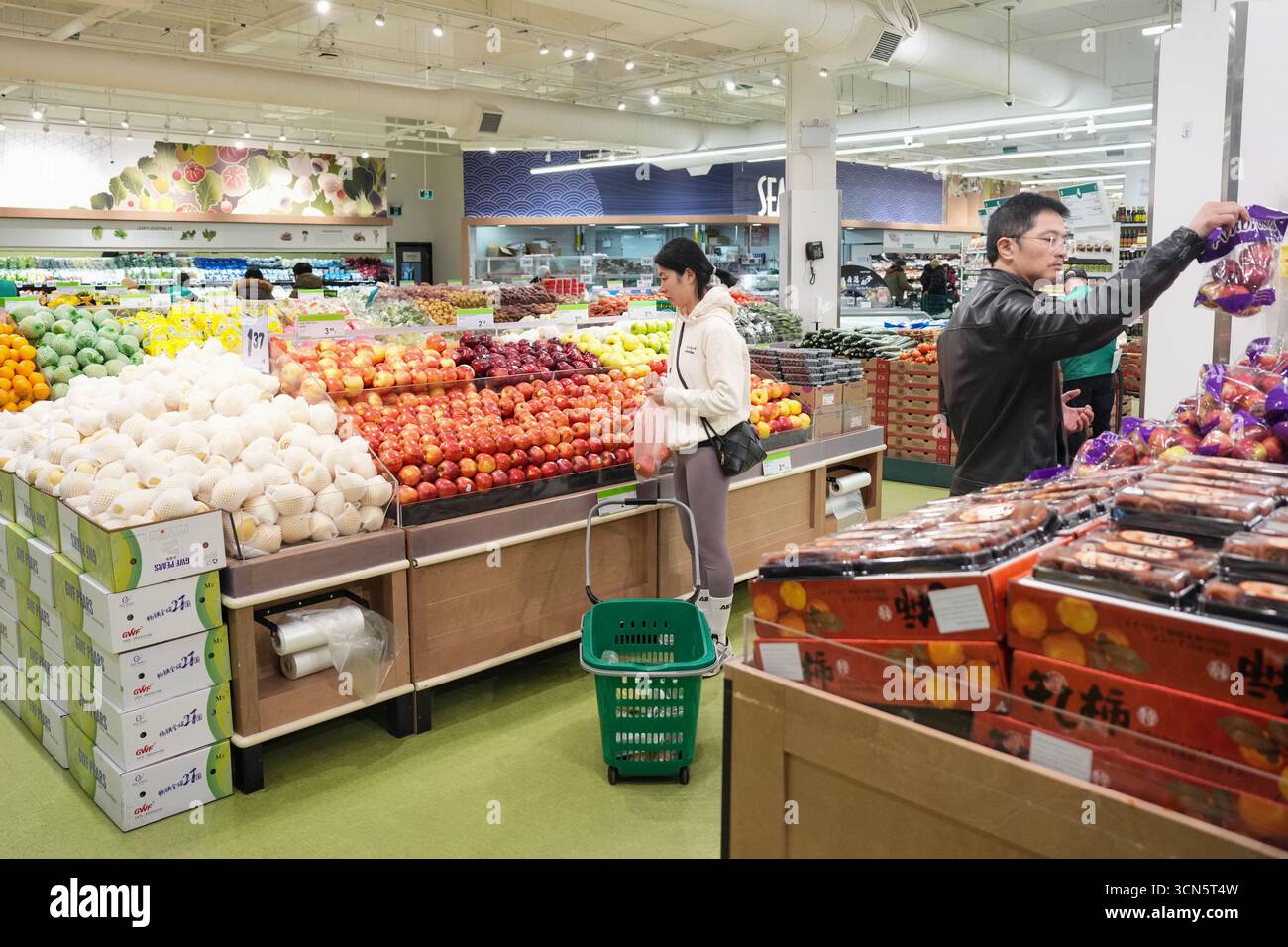 Customers shop for produce at T&T Supermarket's location in Toronto's ...