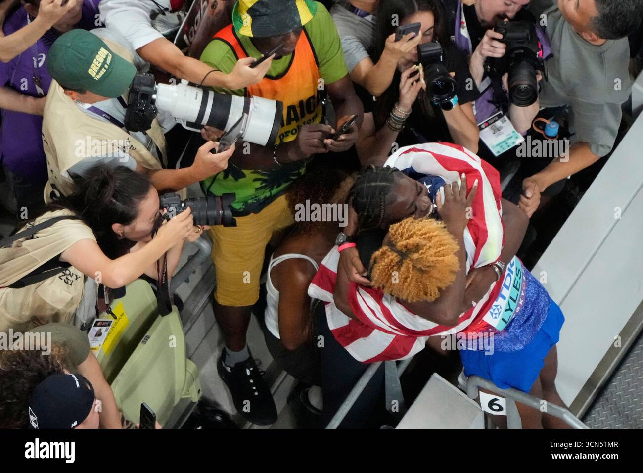 United States' Noah Lyles gets a hug as he celebrates after winning the ...
