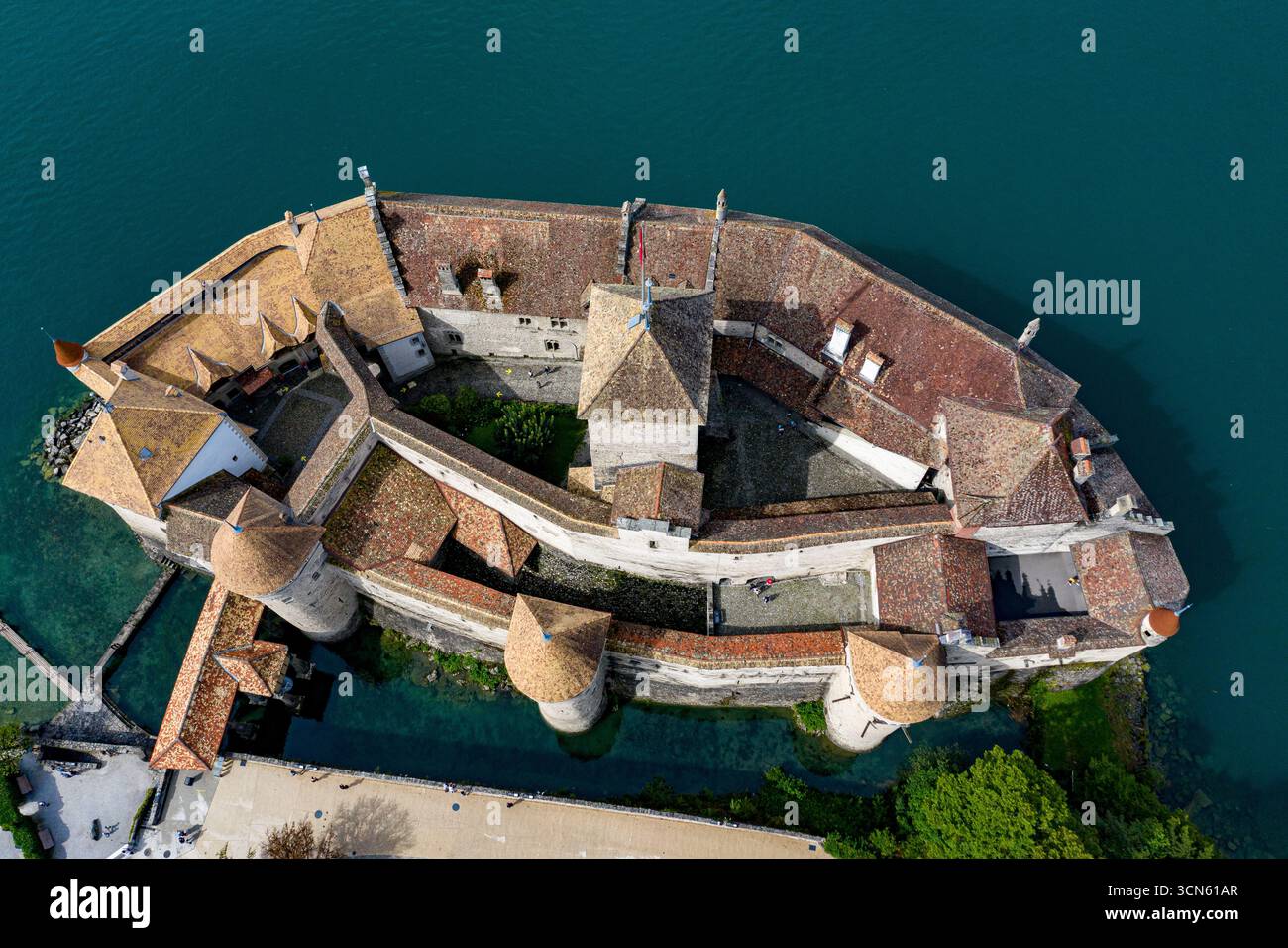 Aerial view of Château de Chillon, a medieval castle with red-tiled ...