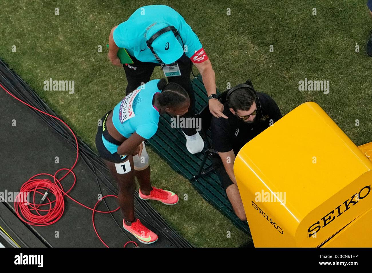 Bahamas' Anthonique Strachan, bottom, is shown her false start by ...