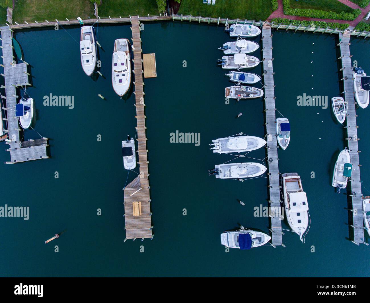 Aerial view of boats nestled in the harbor, wooden docks creating ...