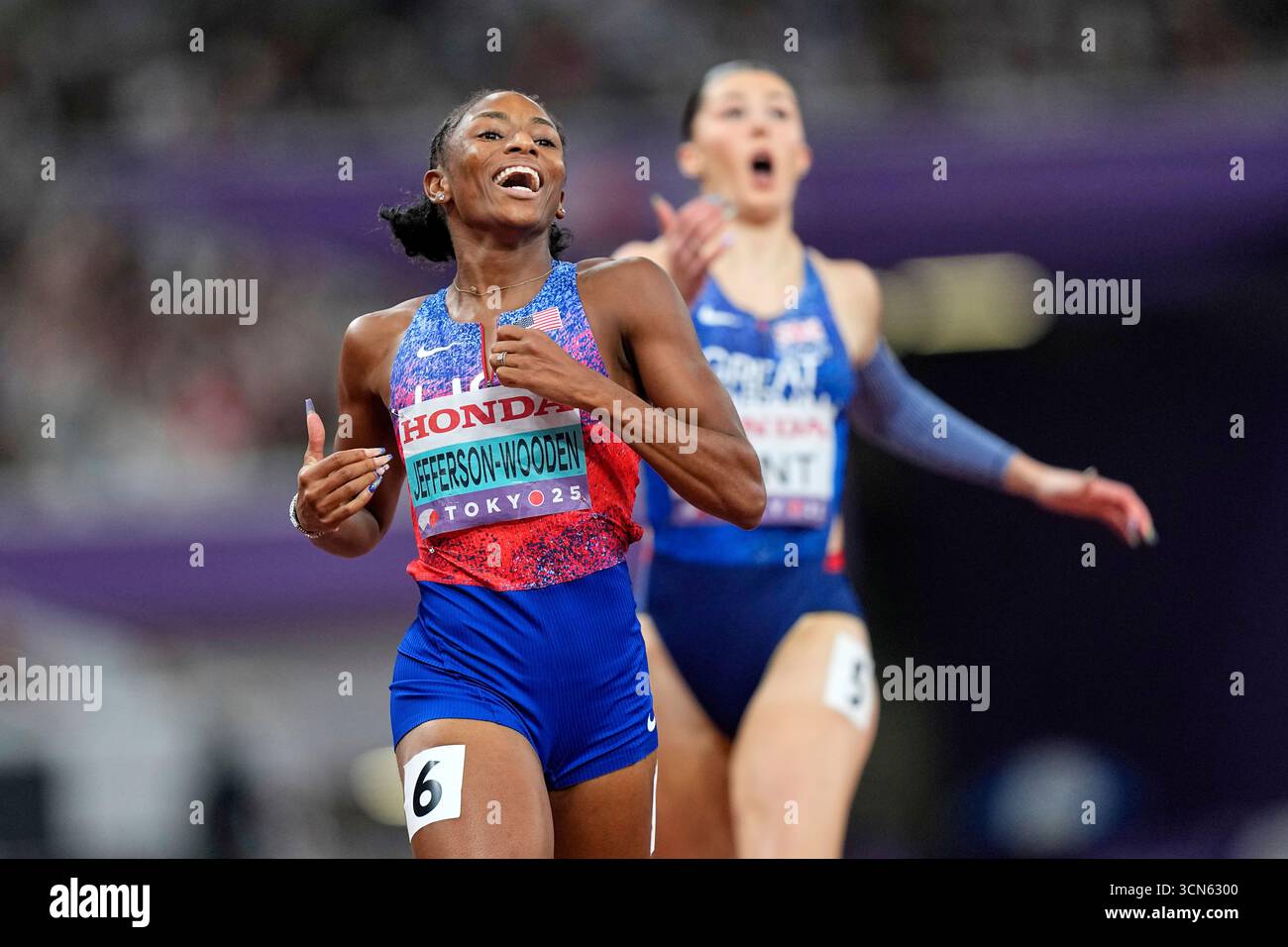 United States' Melissa Jefferson-Wooden celebrates as she wins the gold ...