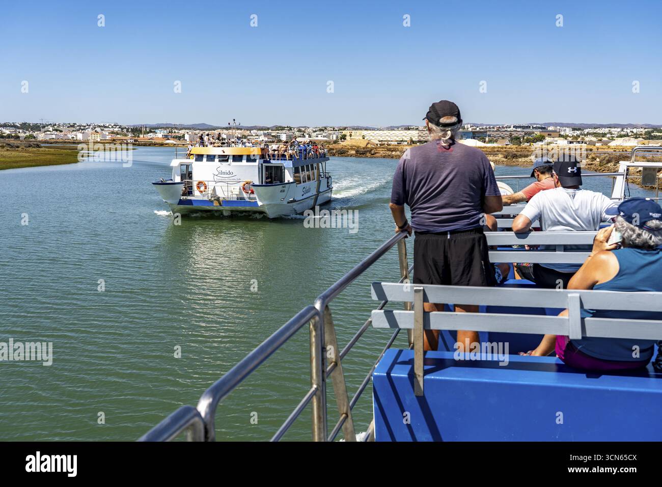 Ride on the Silnido ferry from Tavira on the Gilao River to the beach ...