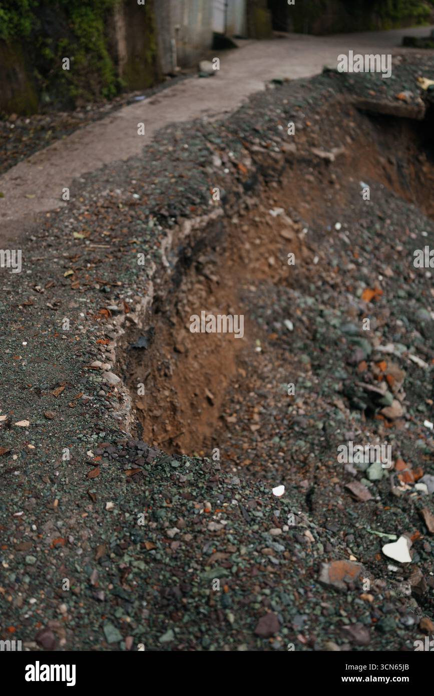 Landslide on mountain road after heavy rain disaster Stock Photo - Alamy