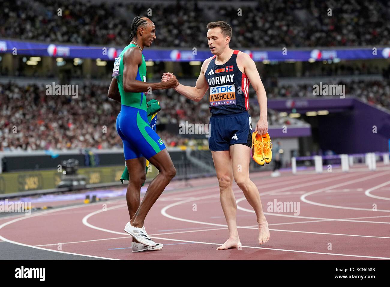Brazil's Alison Dos Santos, silver, greets Norway's Karsten Warholm ...