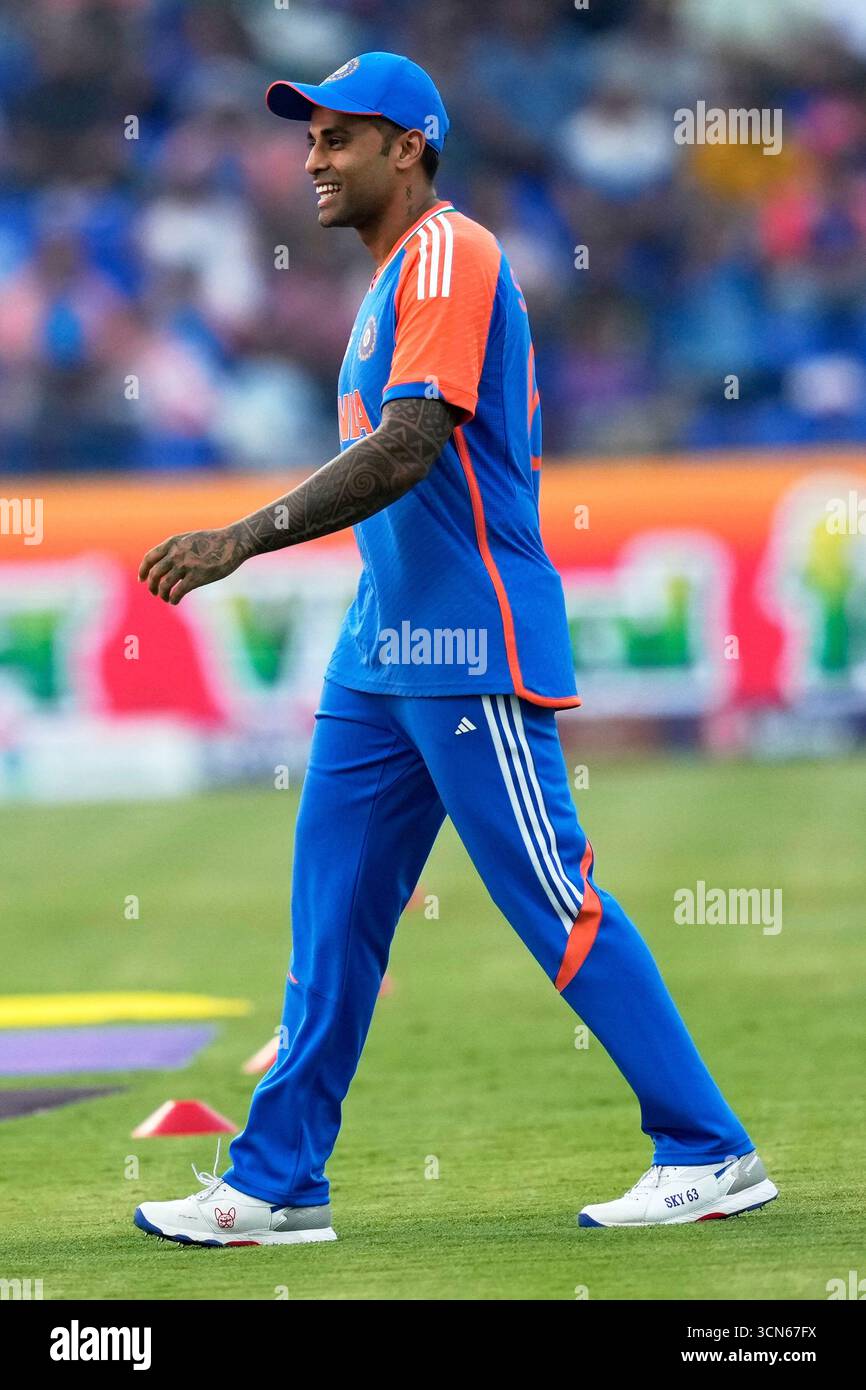 India's captain Suryakumar Yadav walks back after toss a coin during ...