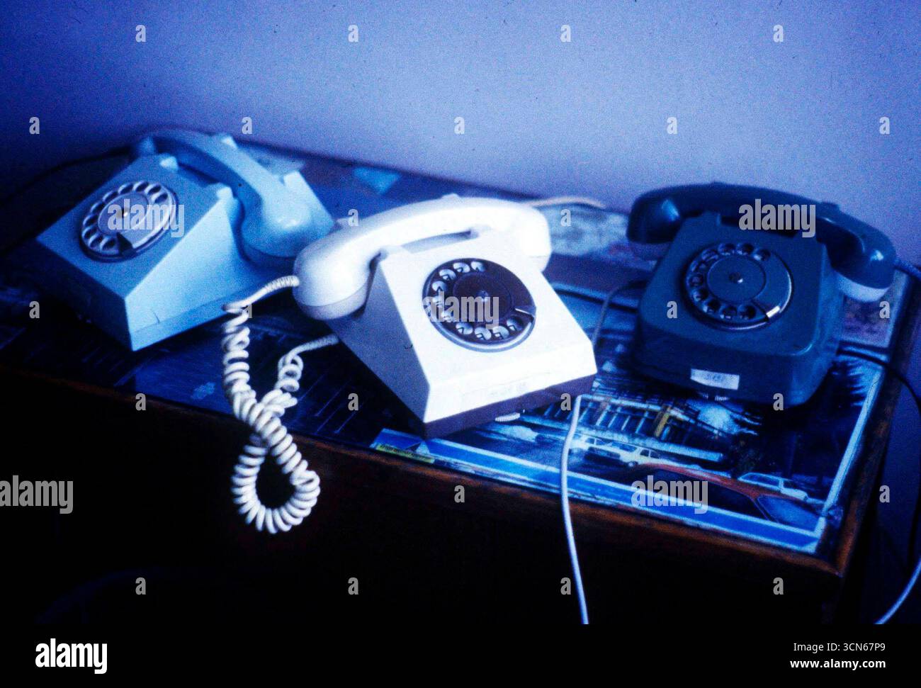 a vintage landline telephone for calling, retro phone set on a table a ...