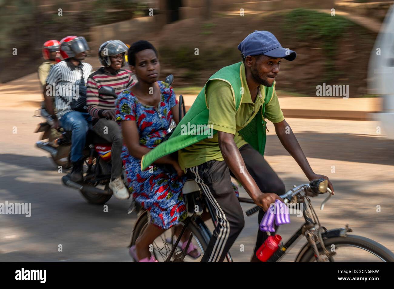 A velo-taxi speeds in the streets of Kigali, Rwanda, Friday, Sept. 19 ...