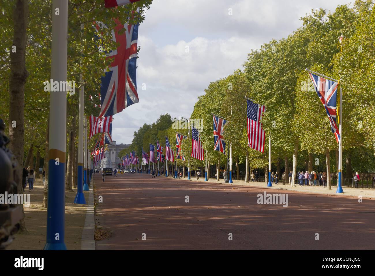 The Mall, London, lined with alternating Union Jack and USA flags ahead ...