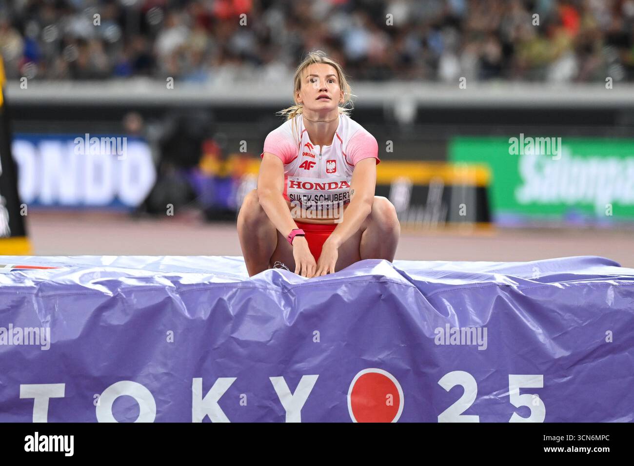 Adrianna Sulek-Schubert (Poland) kneeling on the high jump mat during ...