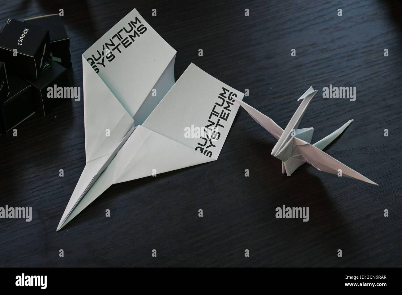 Origami swans and paper airplanes made with branded paper from "Quantum ...