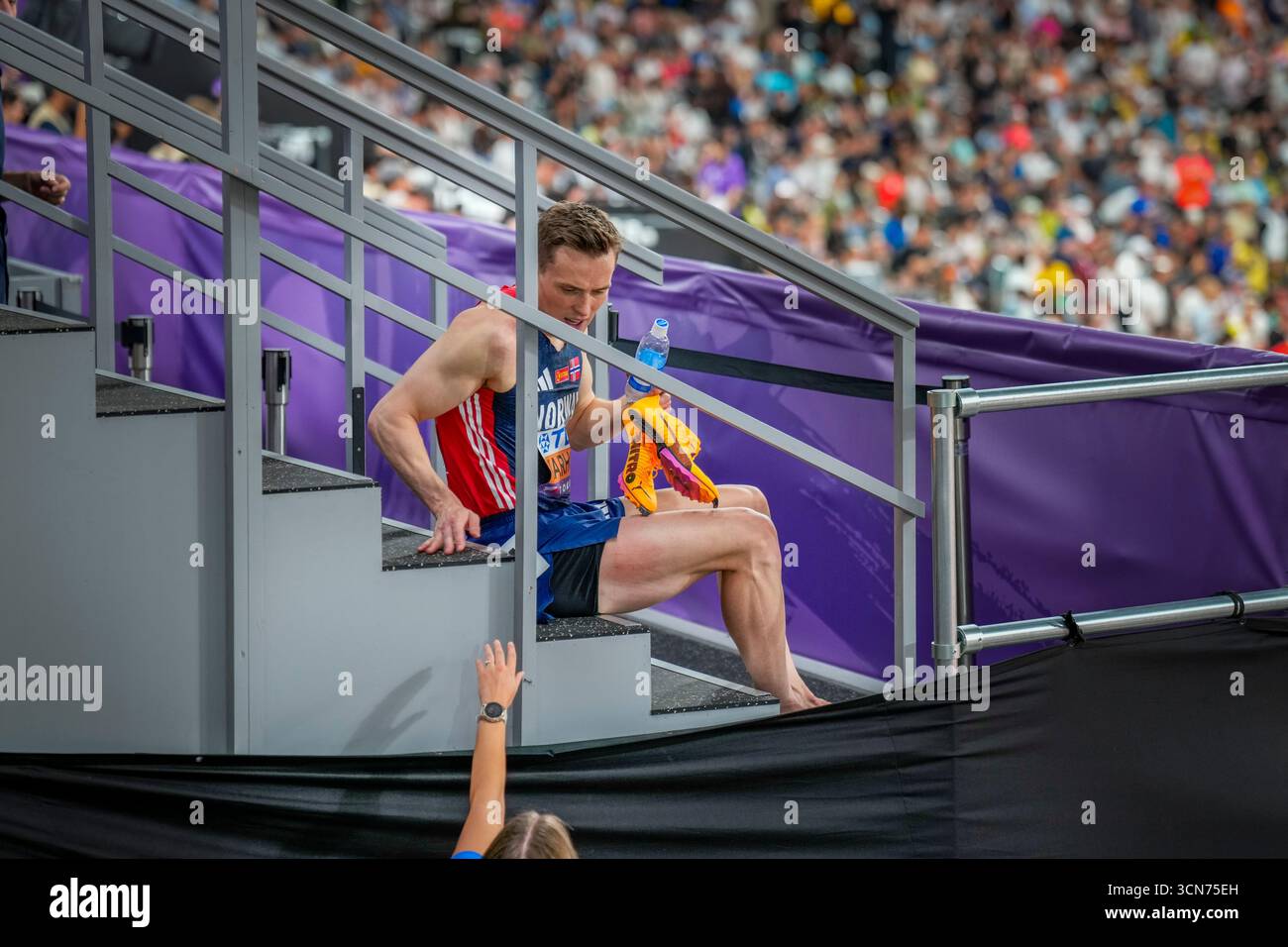 Tokyo, Japan 20250919. Girlfriend Oda Djupvik extends a hand to Karsten ...