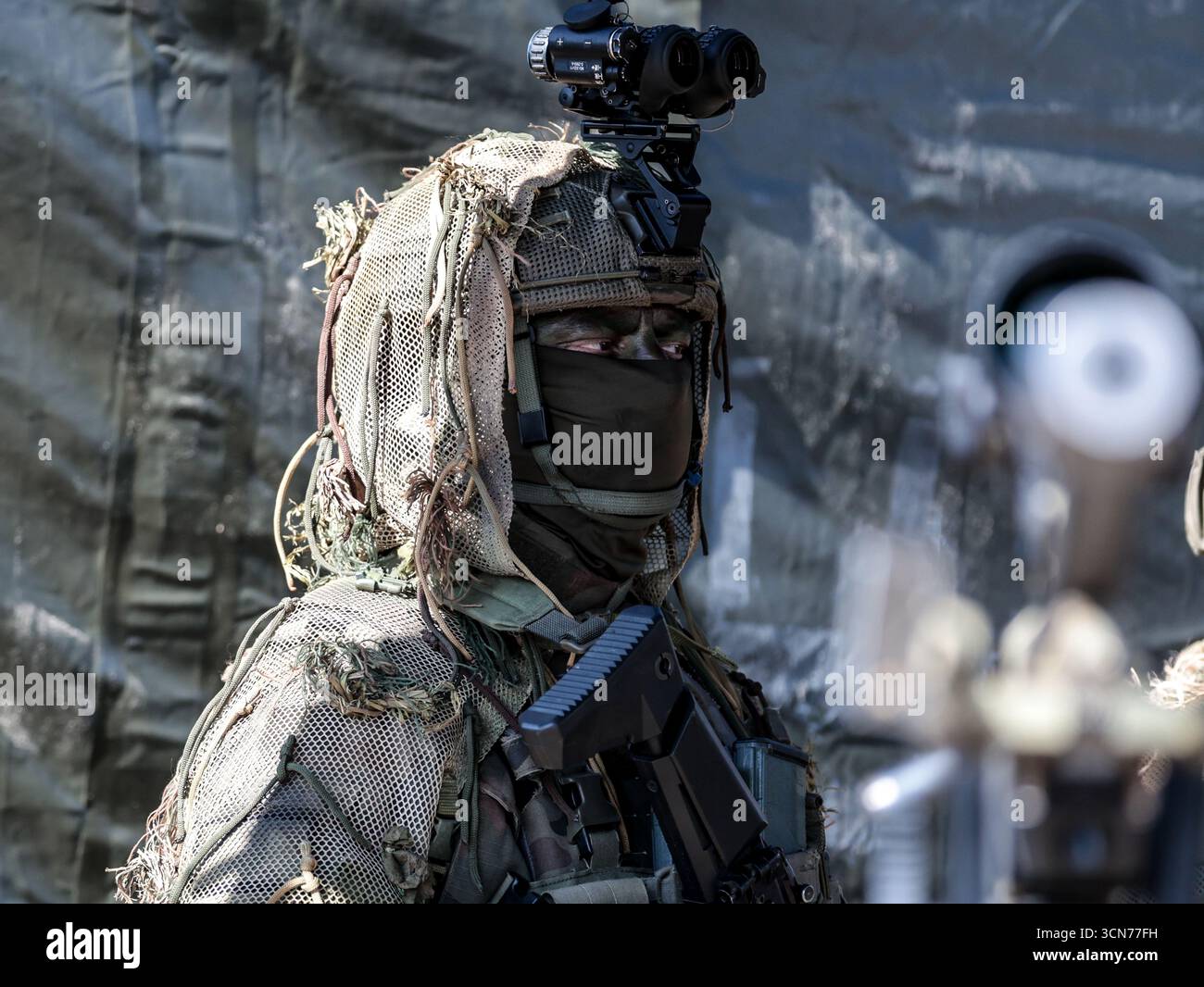 A Polish infantry sniper of the Territorial Defense Forces train live ...