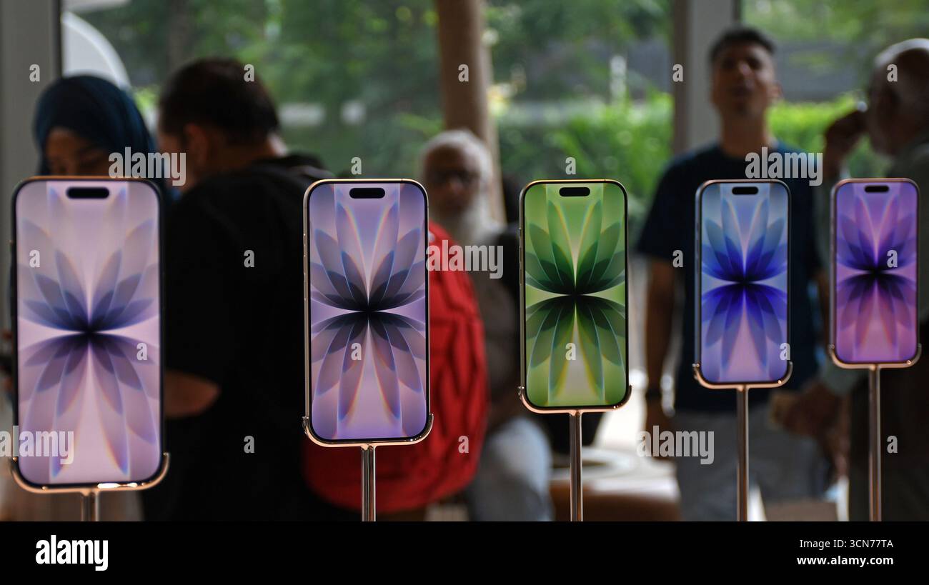 Models of iPhone 17 series mobile phones seen on display inside the ...