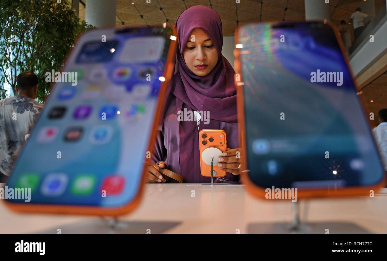 Mumbai, India. 19th Sep, 2025. A woman checks iPhone 17 series mobile ...