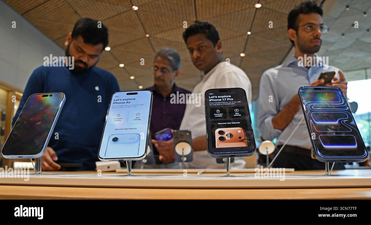 People check models of iPhone 17 series kept on display inside the ...