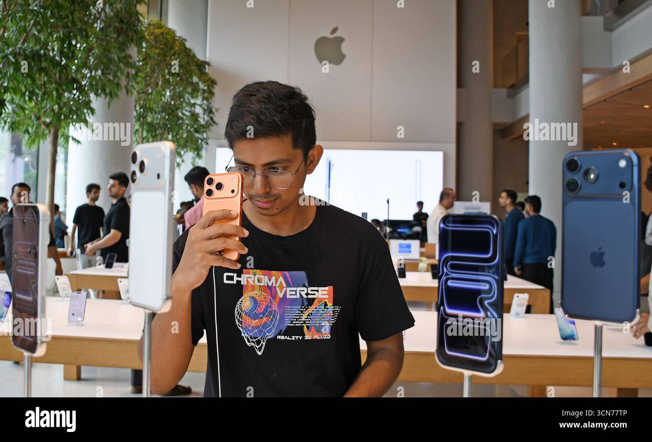 Mumbai, India. 19th Sep, 2025. A man checks iPhone 17 series mobile ...