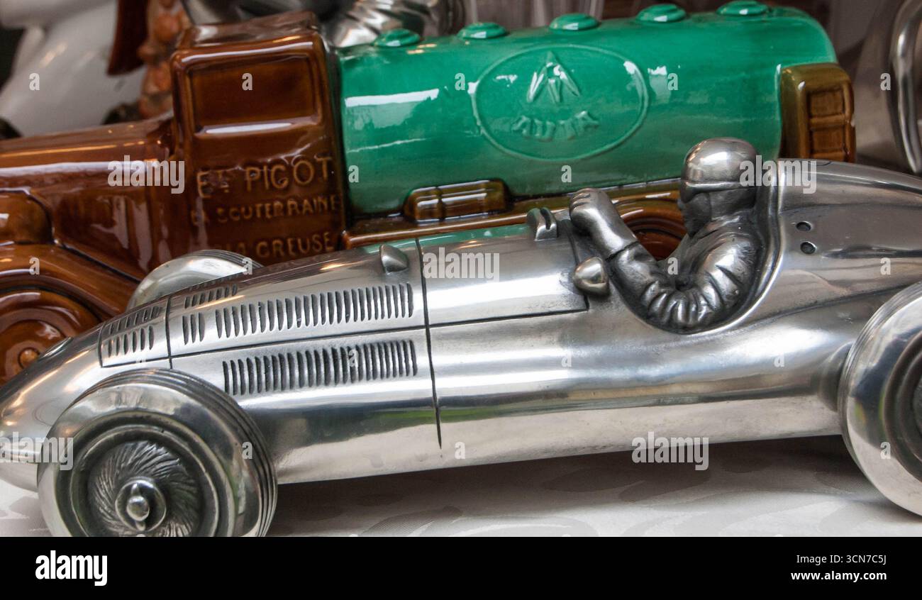 Vintage toy racing car with driver and truck at flea market in Paris ...