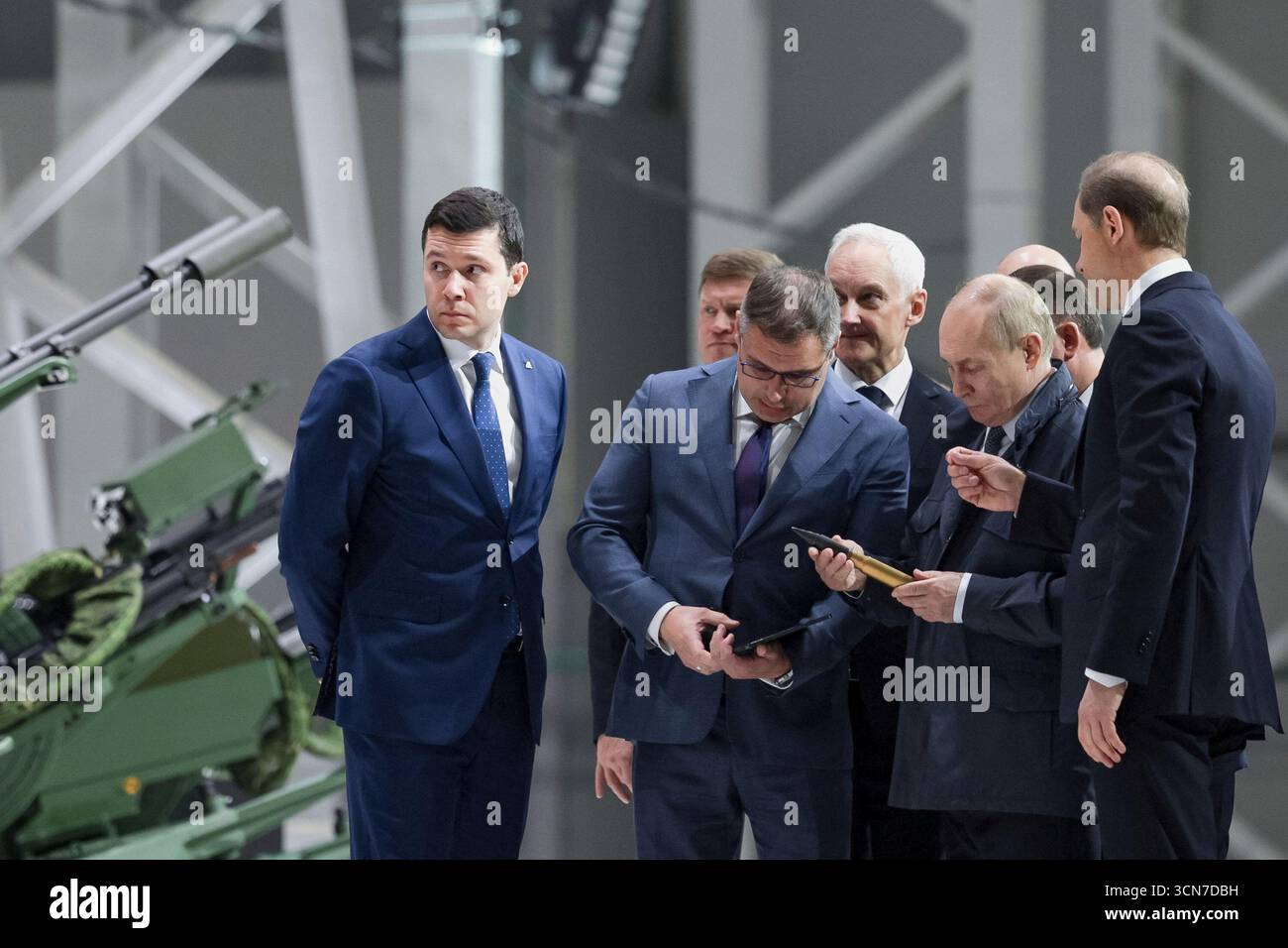 Russian President Vladimir Putin, second right, visits the Motovilikha Plants, a metallurgical ...