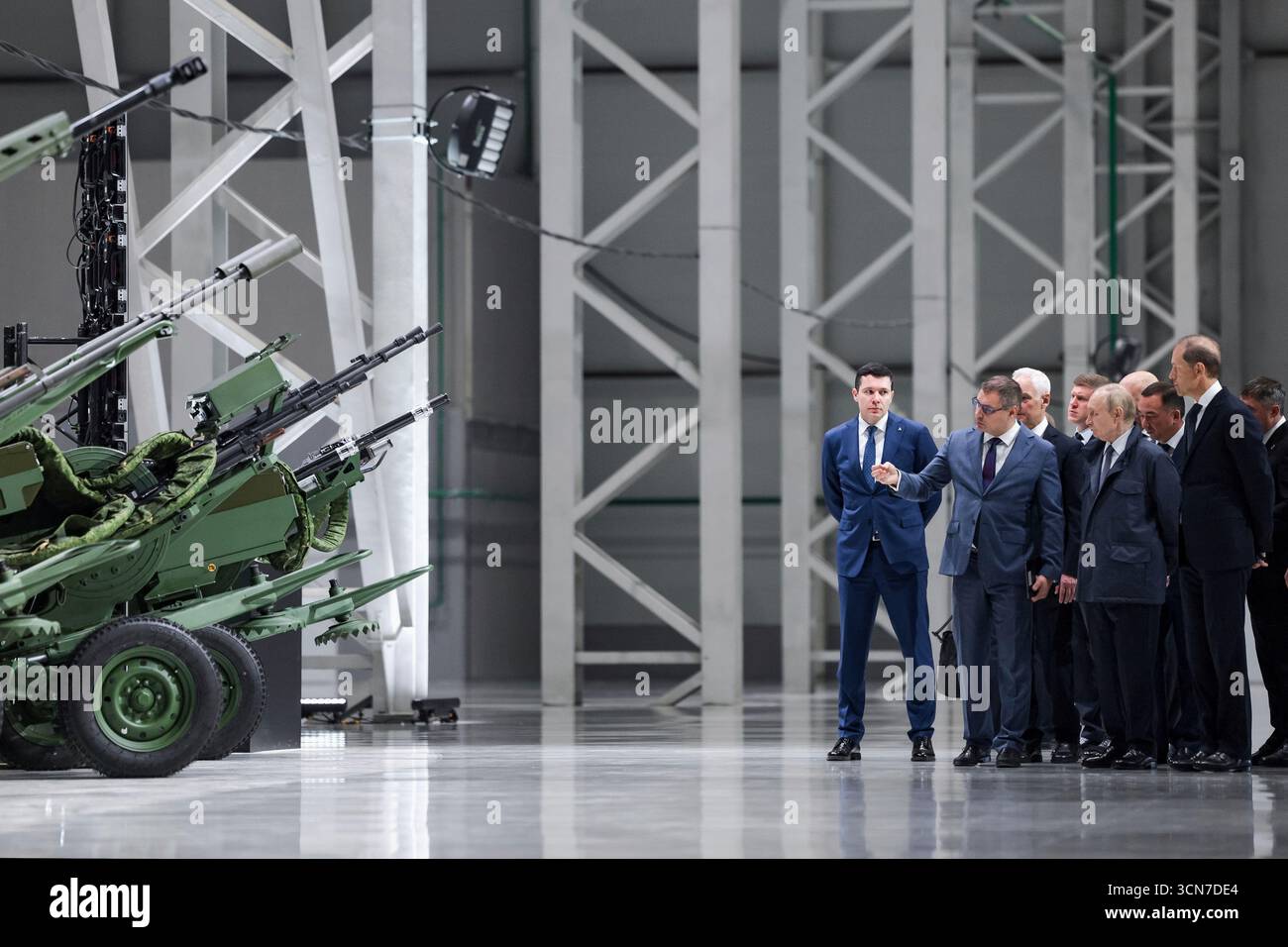 Russian President Vladimir Putin, center, visits the Motovilikha Plants, a metallurgical and ...
