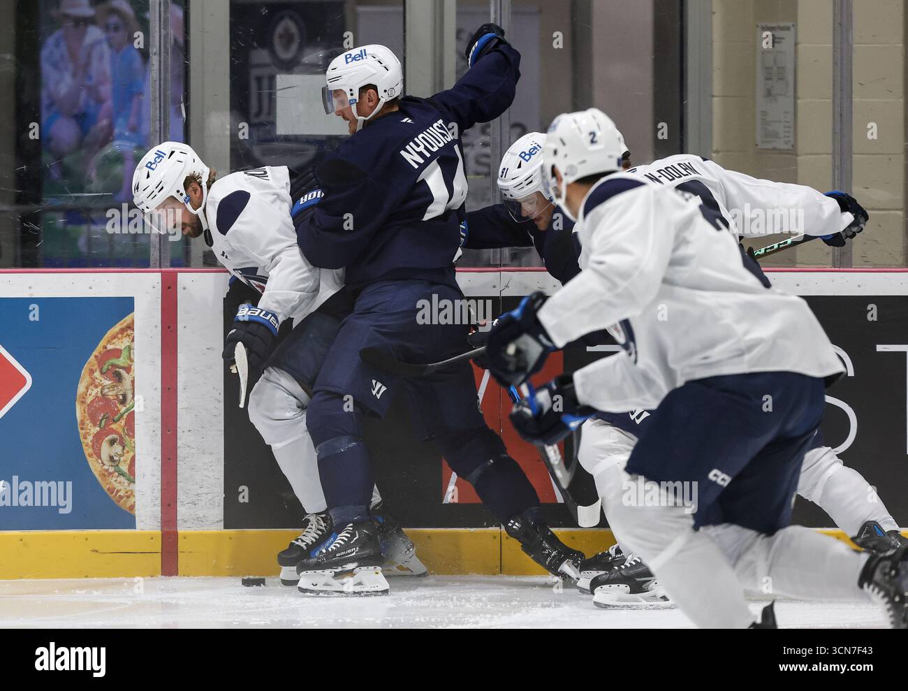 Winnipeg Jets' Josh Morrisssey (44) and Gustav Nyquist (14) battle for ...