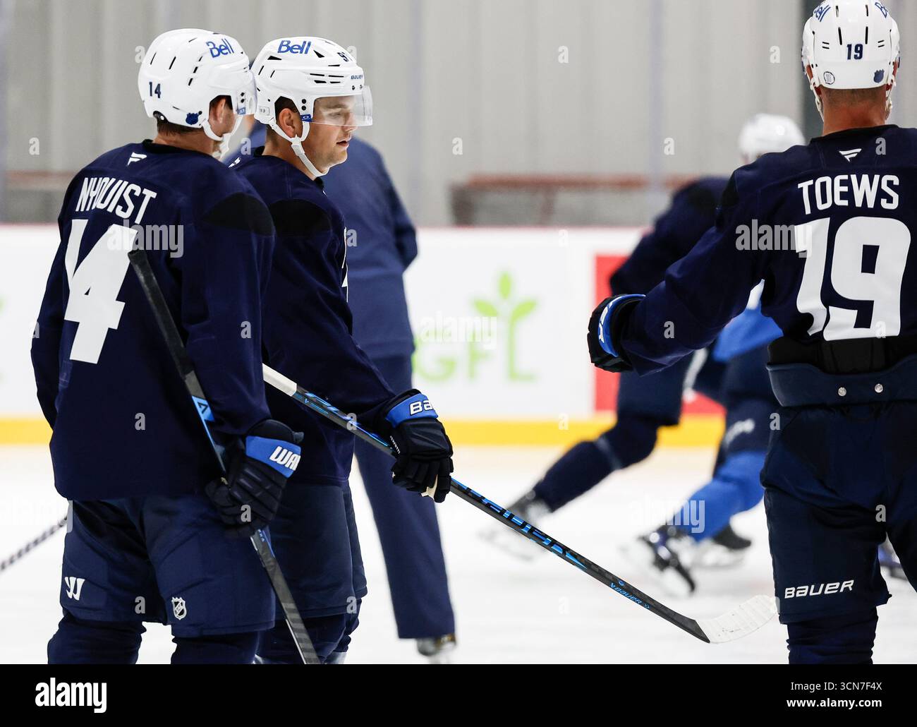 Winnipeg Jets' Gustav Nyquist (14). Cole Perfetti (91) and Jonathan ...